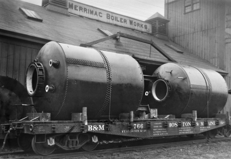 Antique boilers being shipped by train - Helfrich Brothers
